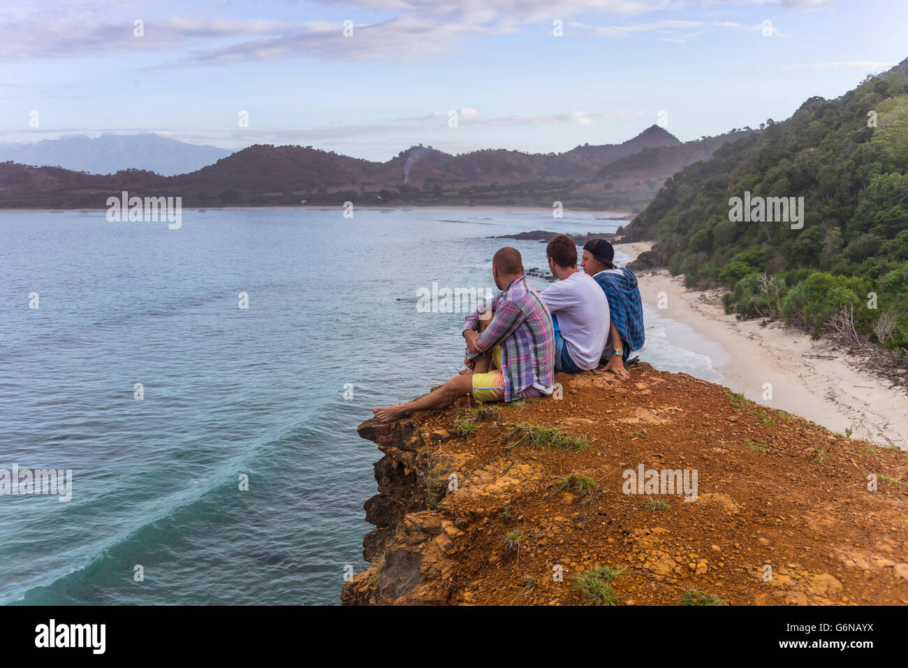 Indonesia, Sumbawa island, Young people sitting on viewpoint Stock ...