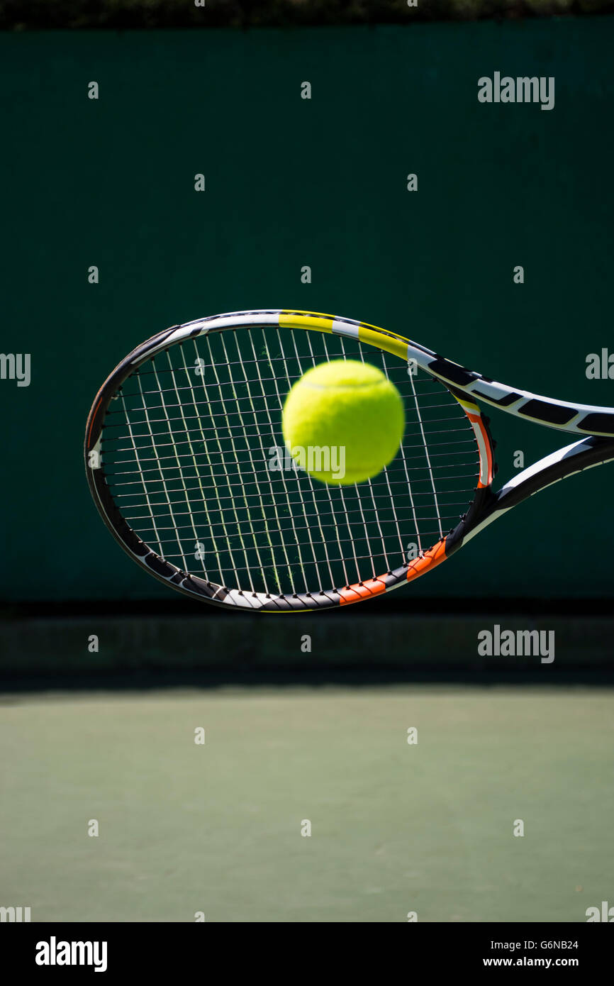 Racket hitting a ball Stock Photo - Alamy