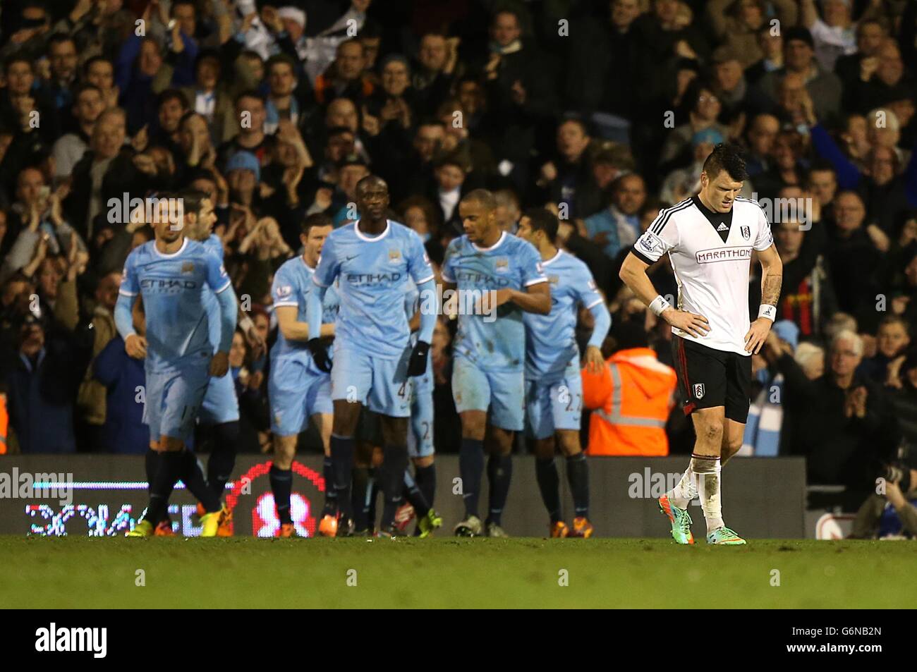 Fulham's John Arne Riise appears dejected after Manchester City's Jesus ...