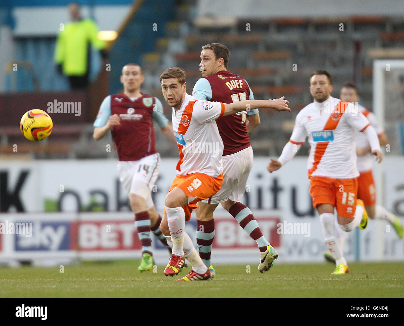 Burnley's Michael Duff (right) and Blackpool's Steven Davies battle for ...