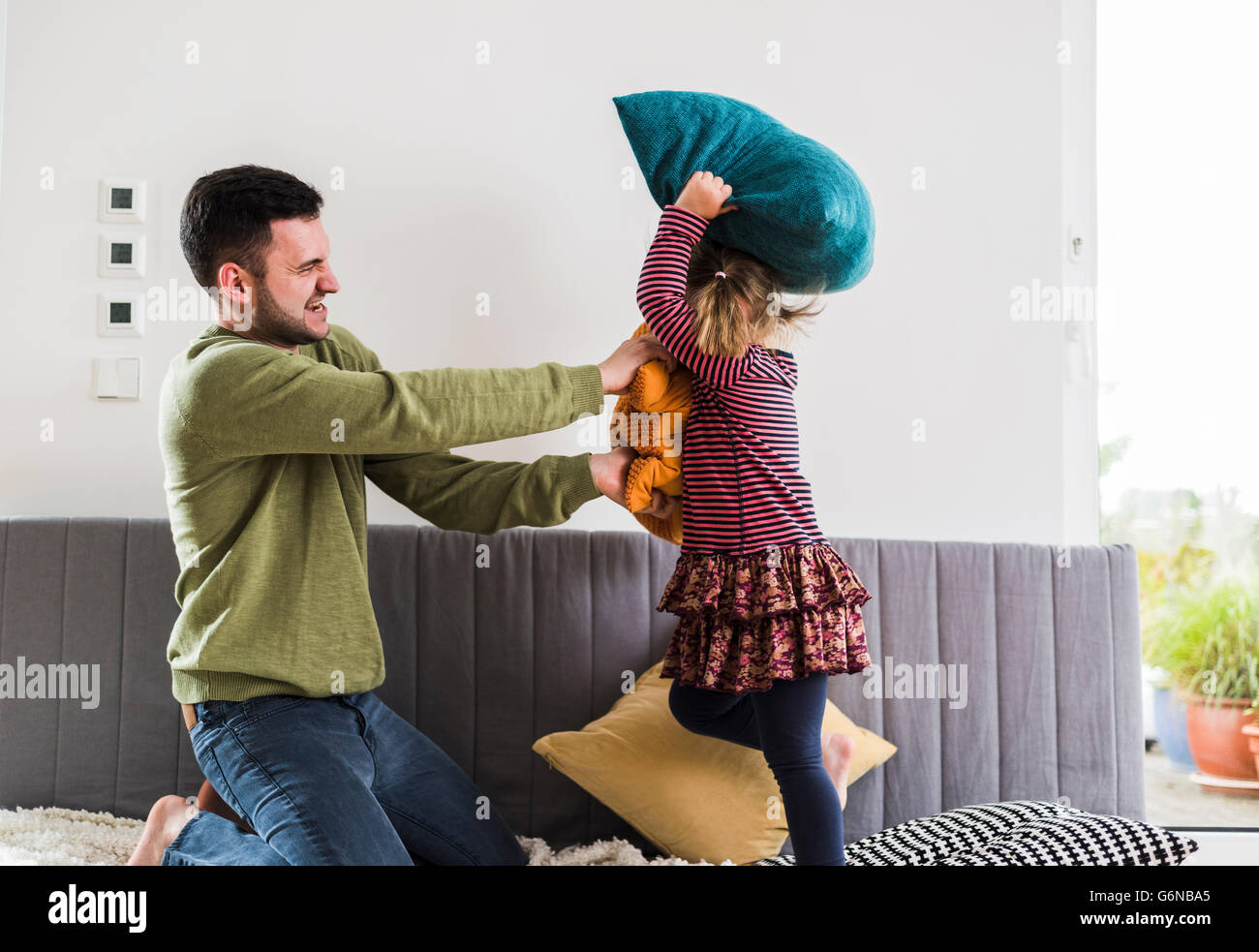 Father daughter having pillow fight hi-res stock photography and images ...