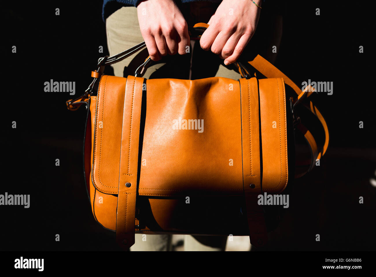 Womans hands holding leather bag hi-res stock photography and images ...