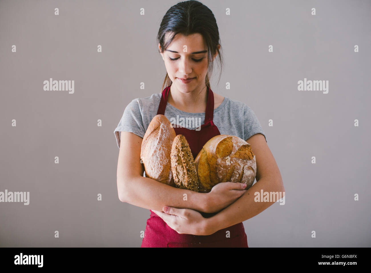 Woman with hand made bread Stock Photo - Alamy