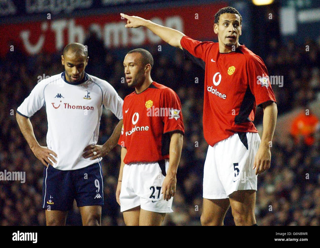 Manchester United's Rio Ferdinand (R) sorts out his defence before a ...