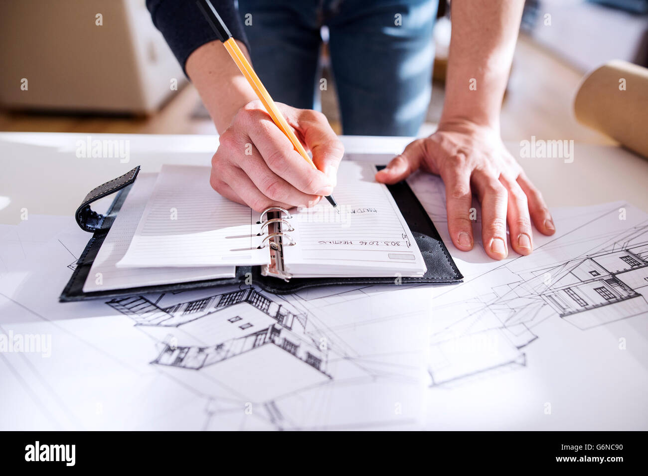 Architect making notes in his personal organiser Stock Photo - Alamy