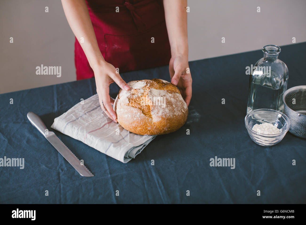 Woman holding hand made bread Stock Photo - Alamy