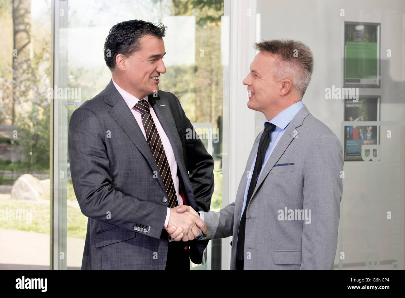 Men in gray suits hi-res stock photography and images - Alamy