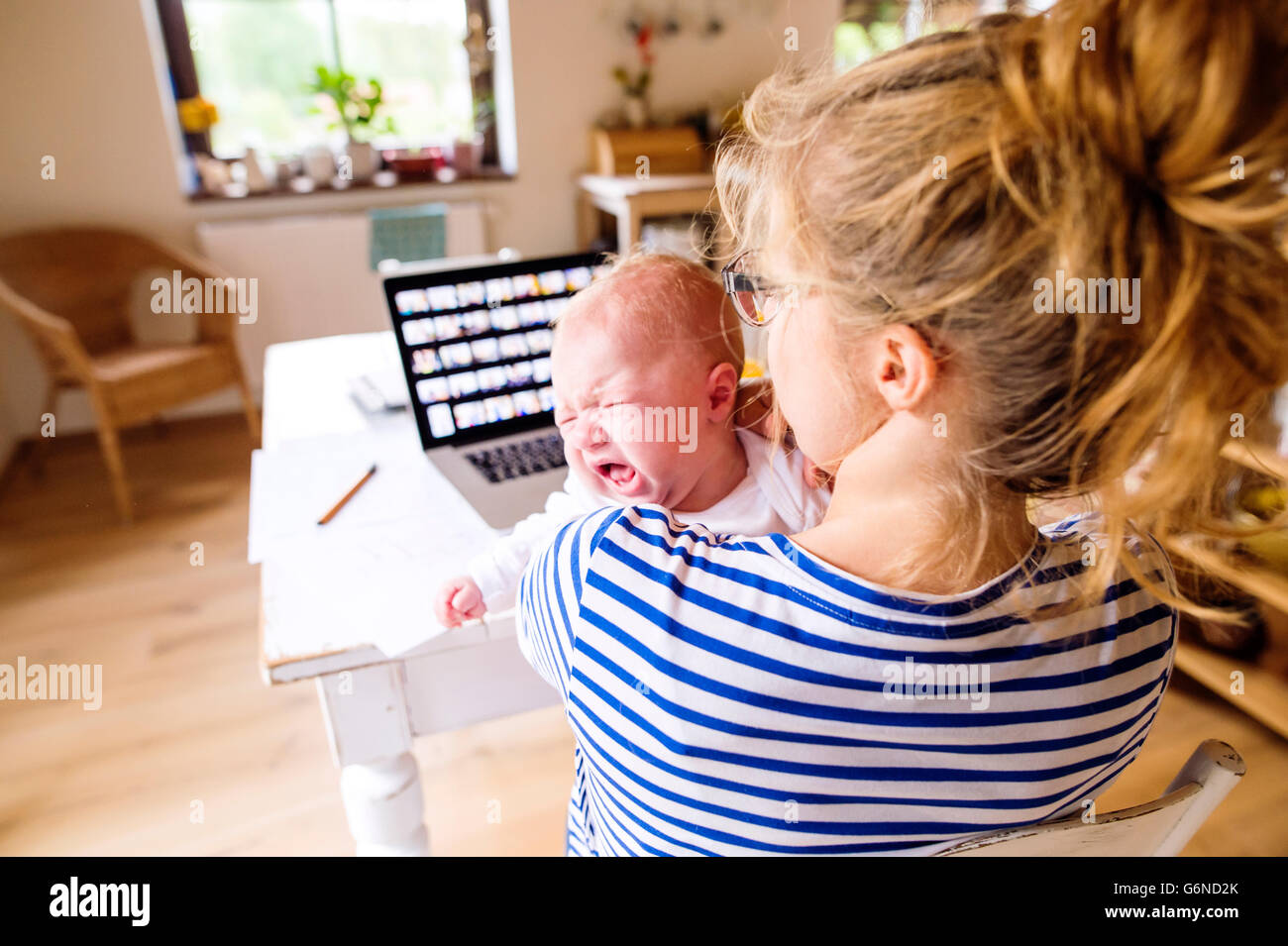Baby with laptop crying hi-res stock photography and images - Alamy