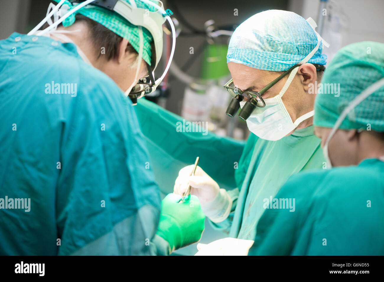 Heart surgeons during a heart operation Stock Photo - Alamy