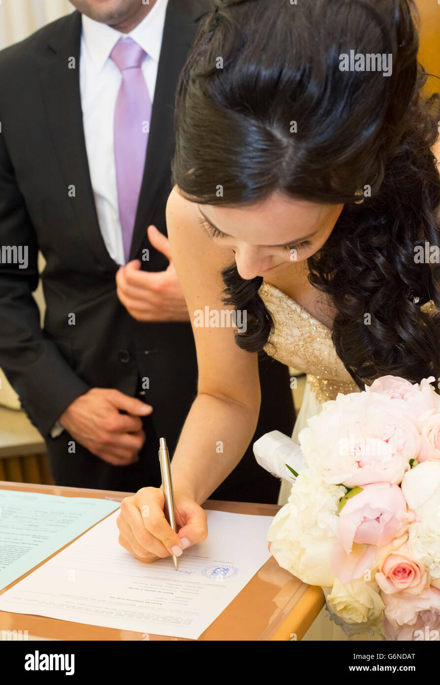 Signing register bride hi-res stock photography and images - Alamy
