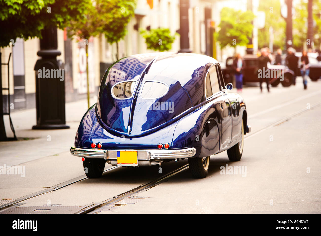 Veteran car street cruise on public roads. rear view Stock Photo - Alamy