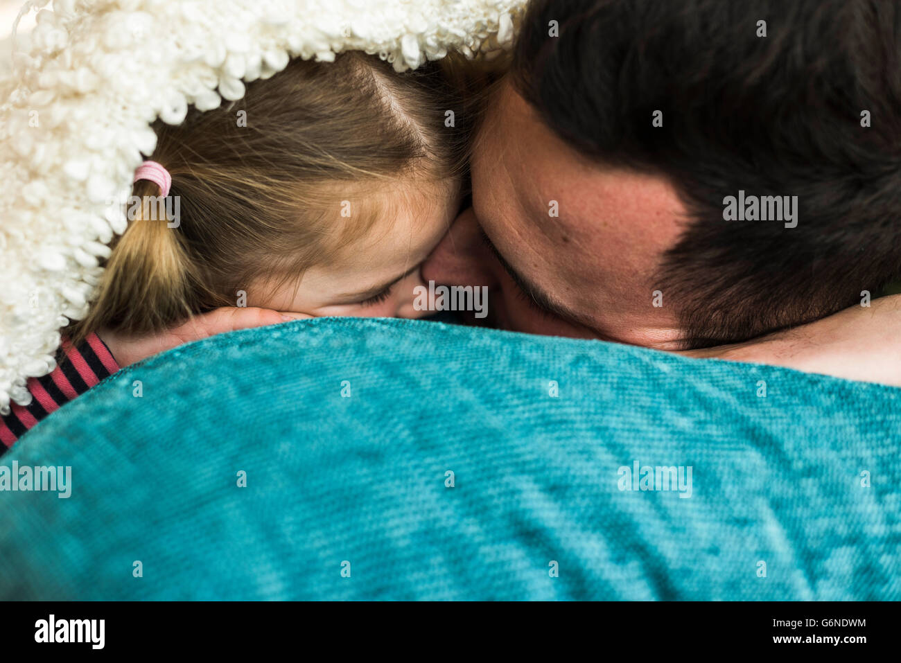 Father and daughter cuddling at home Stock Photo - Alamy