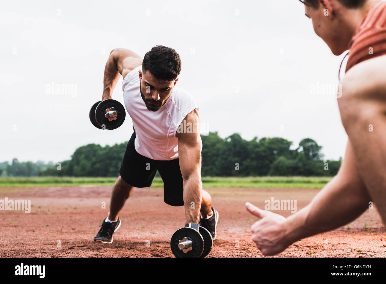 Man supported by friends hi-res stock photography and images - Alamy