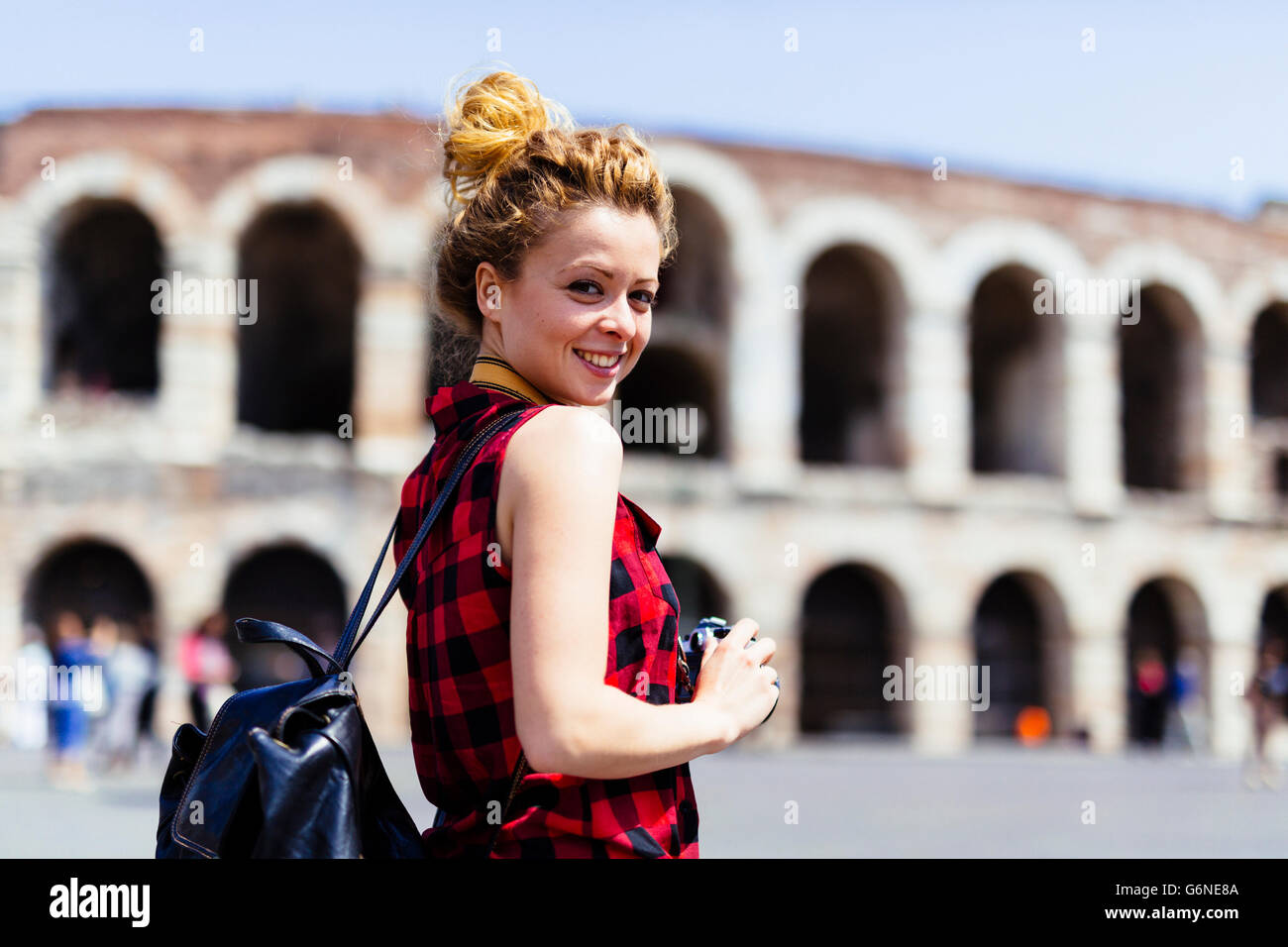 Italy, Verona, smiling woman in front of Verona Arena Stock Photo - Alamy