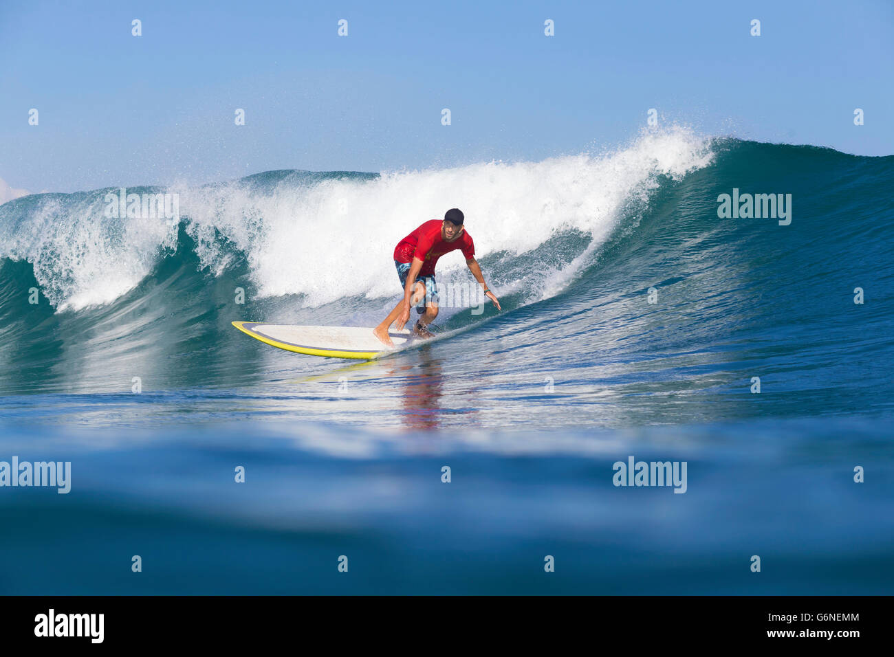 Indonesia, Bali, Surfer on wave Stock Photo - Alamy