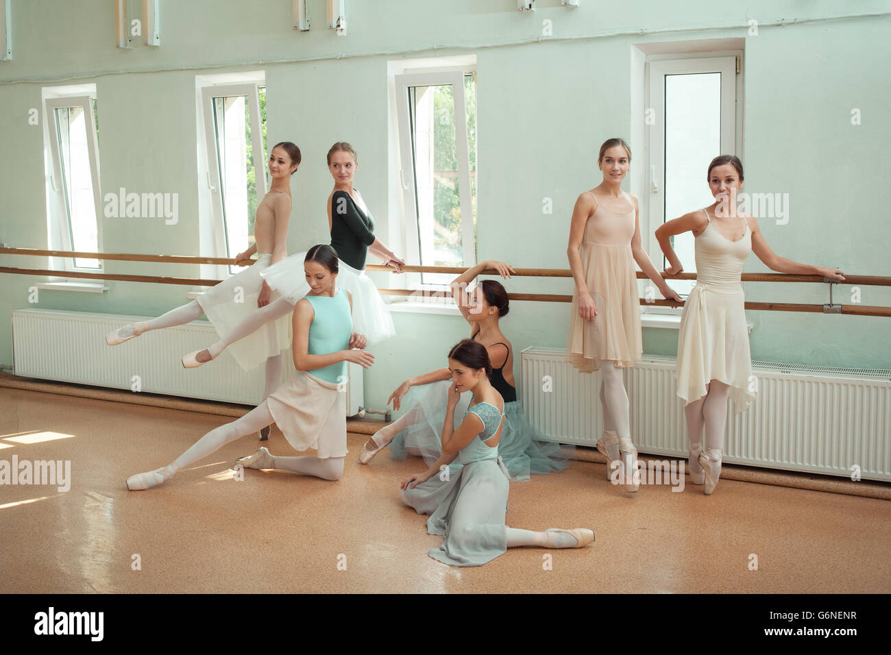 The seven ballerinas at ballet bar Stock Photo - Alamy