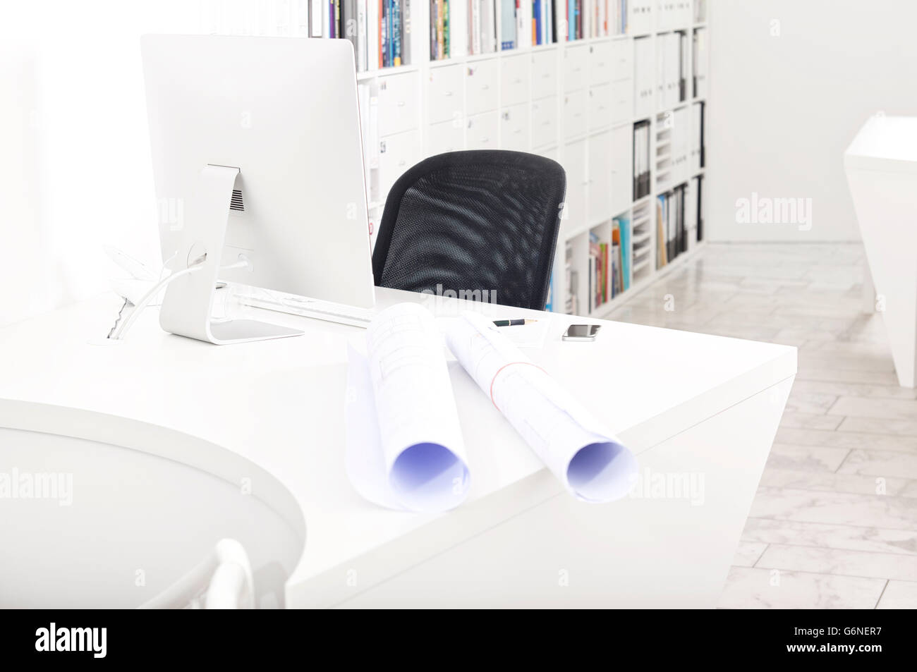 Workspace with construction plans in a modern architecture office Stock ...