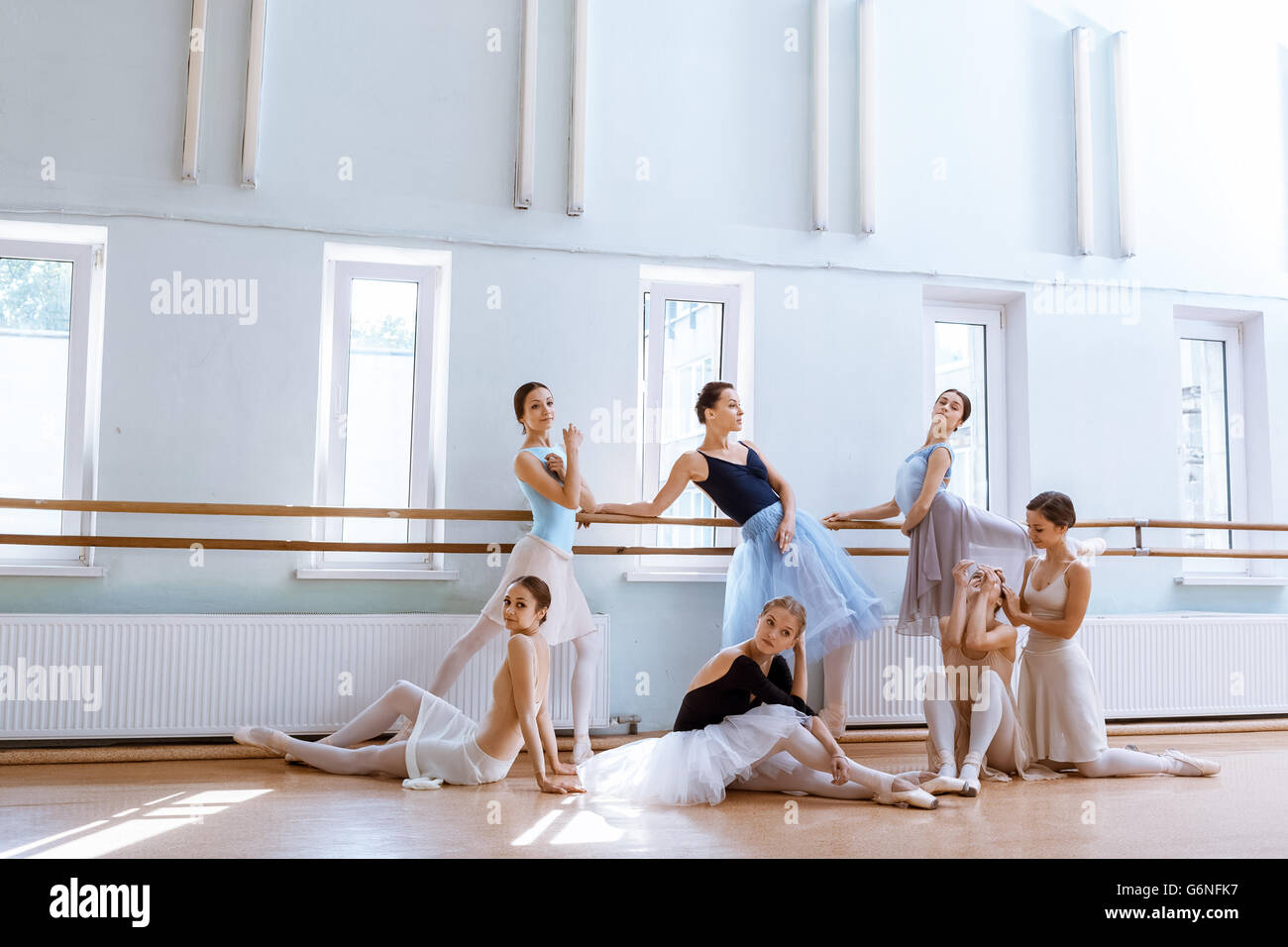 The seven ballerinas at ballet bar Stock Photo - Alamy