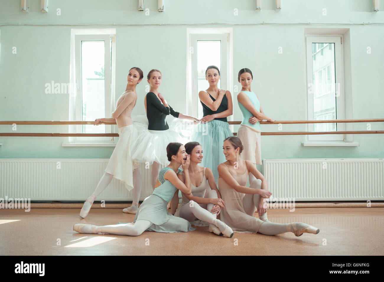 The seven ballerinas at ballet bar Stock Photo - Alamy