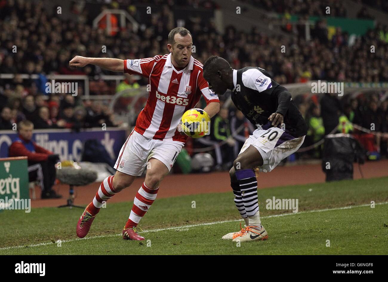 Liverpool's Aly Cissokho (right) and Stoke City's Charlie Adam battle ...