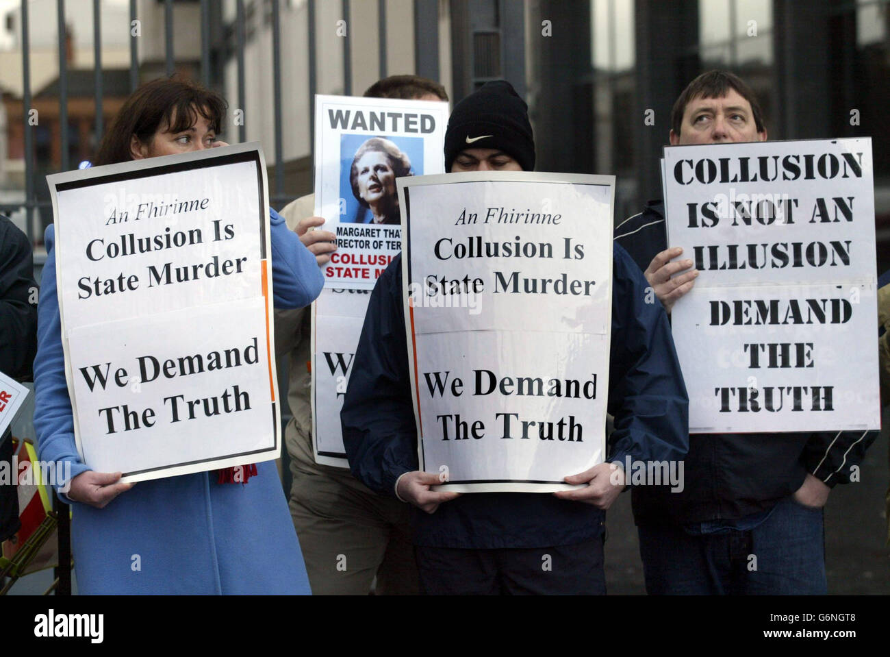 Demonstrators stand outside the Belfast high court, after a judge ruled ...