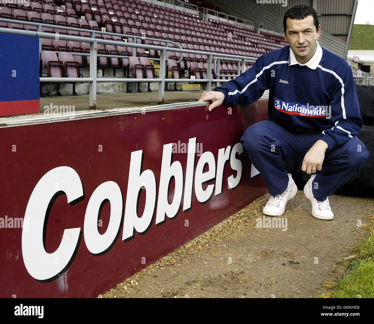Sport football sign crouching colin calderwood hi-res stock photography ...