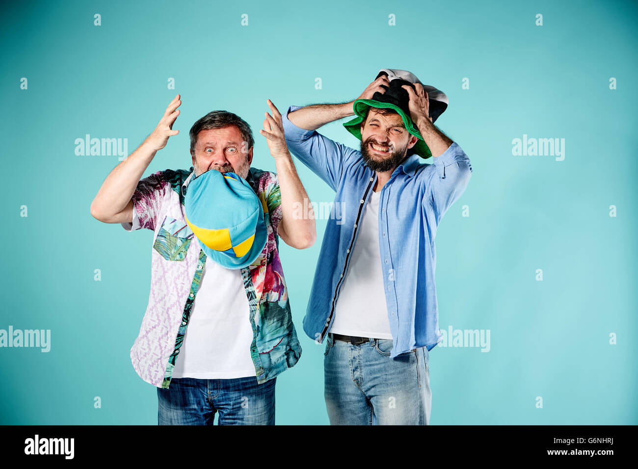 The two football fans over blue Stock Photo - Alamy