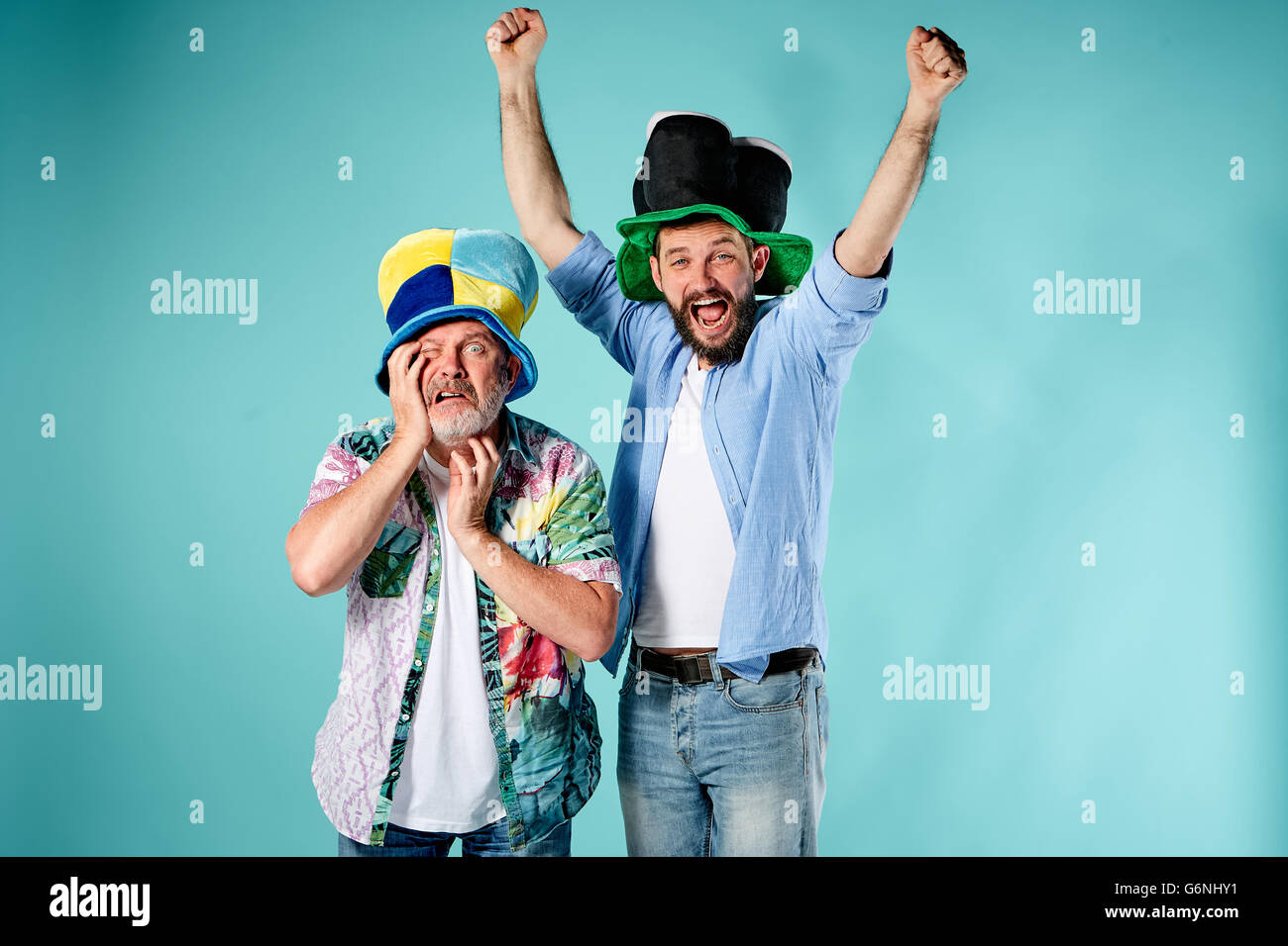 The two football fans over blue Stock Photo - Alamy