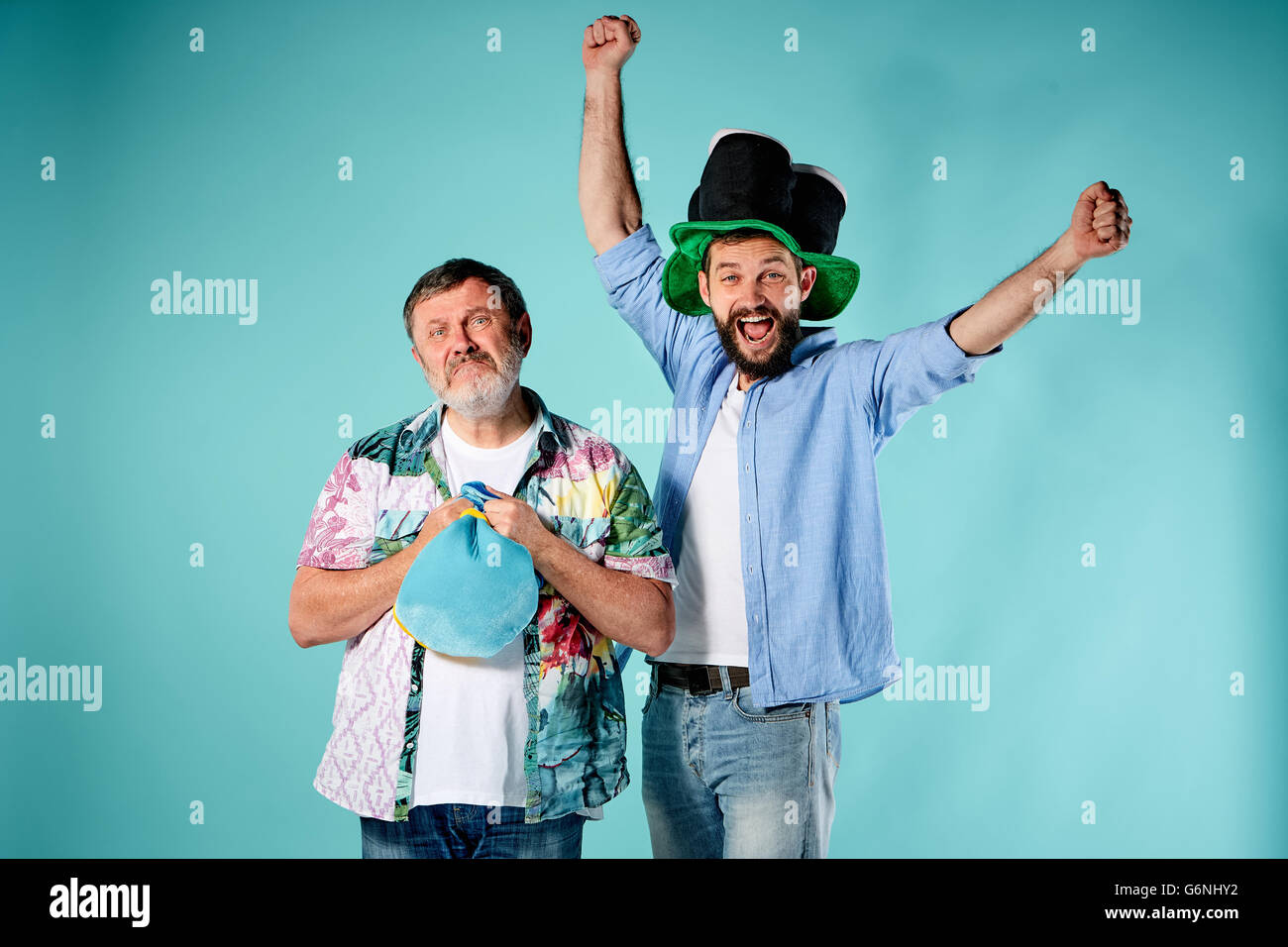 The two football fans over blue Stock Photo - Alamy