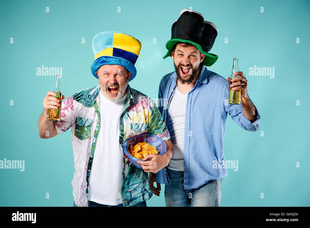 The two football fans over blue Stock Photo - Alamy