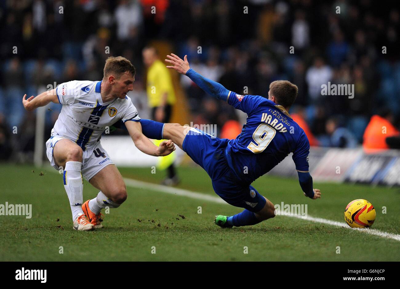 Leicester City's Jamie Vardy goes down under a challenge from Leeds ...