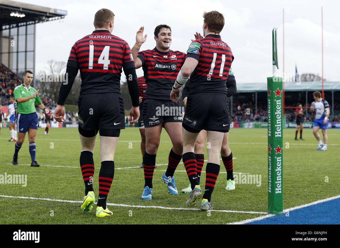 Saracens' David Strettle (right) celebrates scoring his third try with ...