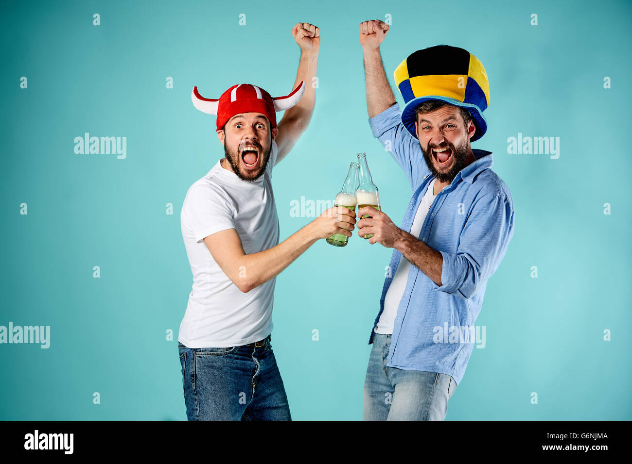 The two football fans over blue Stock Photo - Alamy