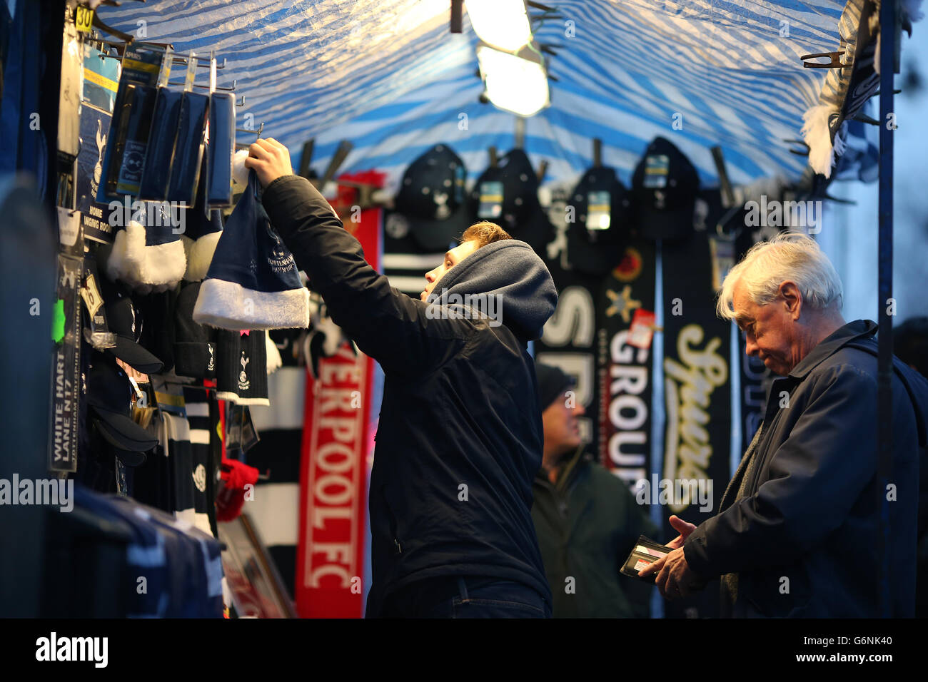 Fans purchase merchandise outside the stadium before the Barclays ...