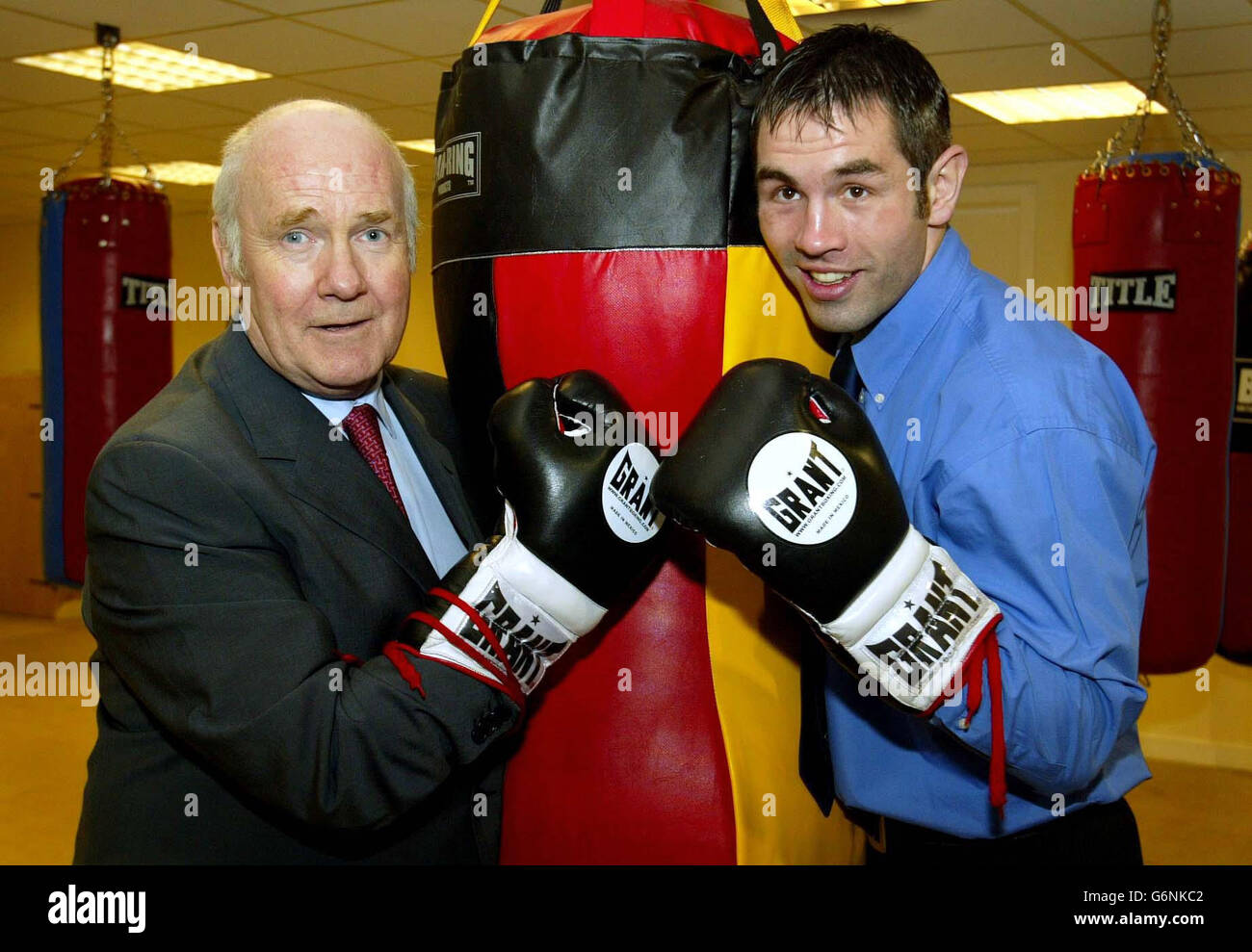 Health Secretary, John Reid, stands in the ring with the new WBU World ...