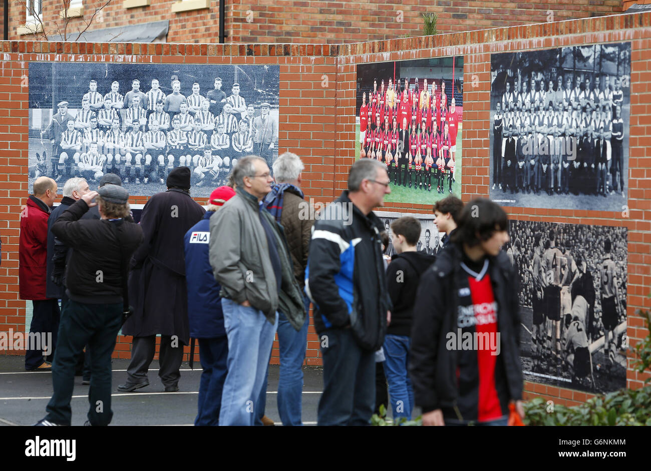 Football fans look at historic AFC Bournemouth pictures on the wall ...