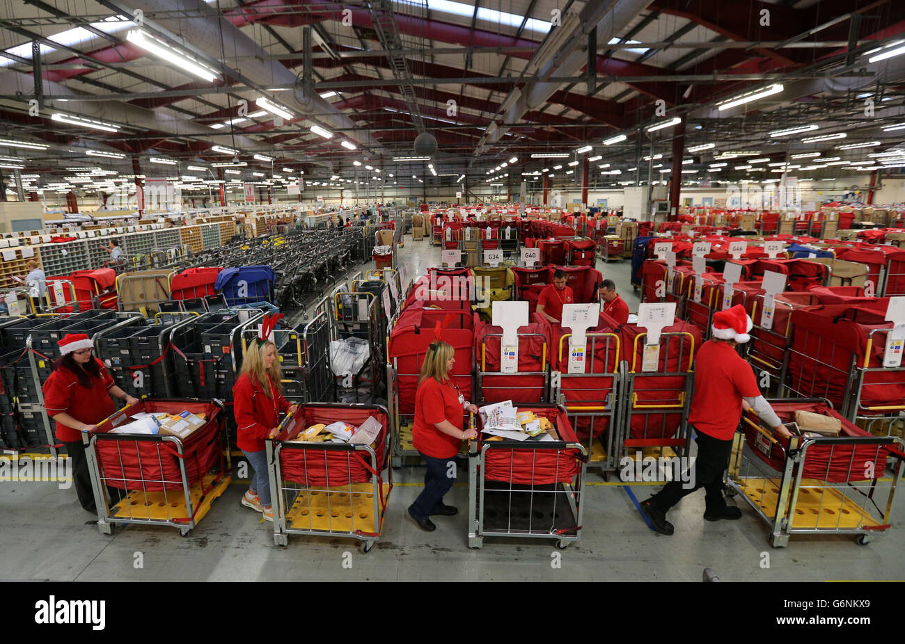 Royal Mail employees with Christmas post at Glasgow Mail Centre, during ...
