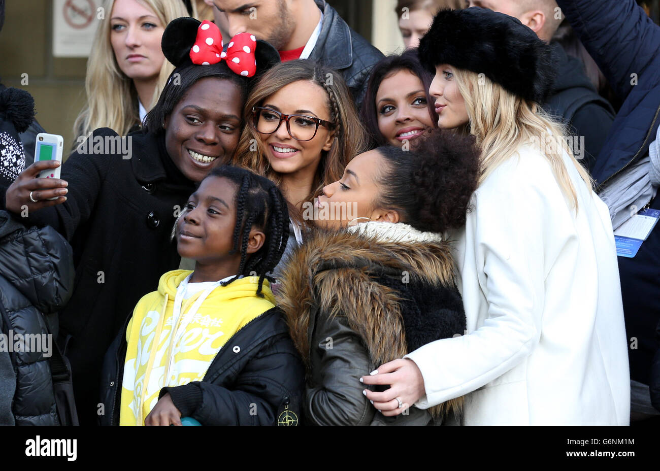 Little Mix pose for photos as they accompany children from the Carers ...