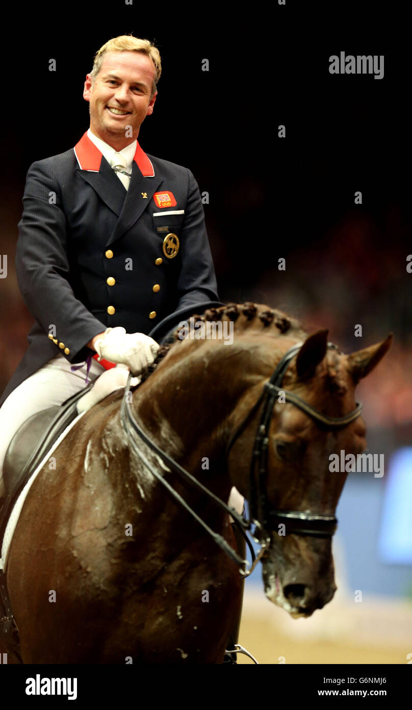Great Britain's Carl Hester riding Fine Time competes in the Reem Acra ...