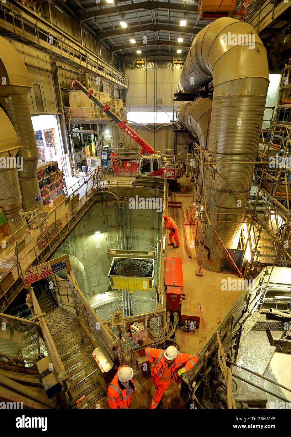 A full spoil skip is raised to the surface to be emptied from boring ...