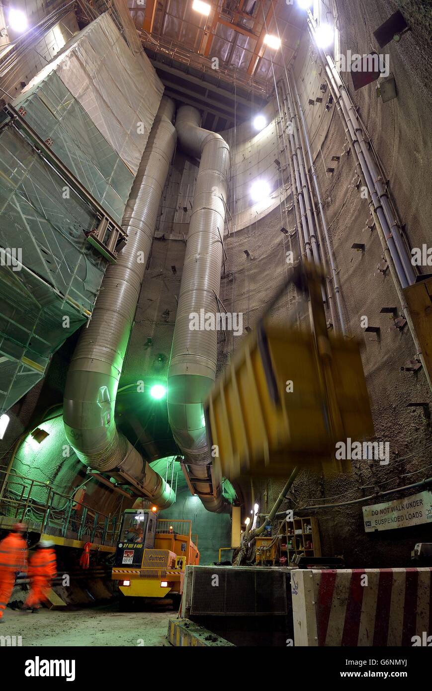 A full spoil skip is raised to the surface to be emptied from boring ...