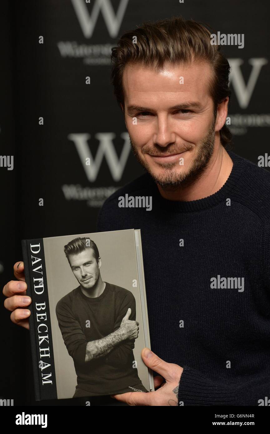 Footballer David Beckham with a copy of his new self titled book, ahead ...