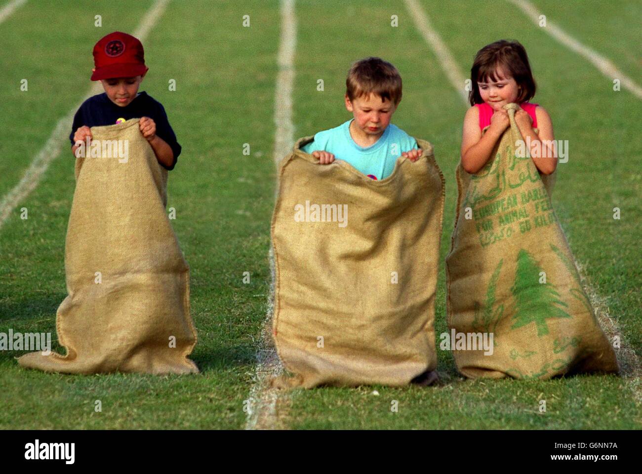Childrens School Sports Day. Sack Racing Stock Photo - Alamy