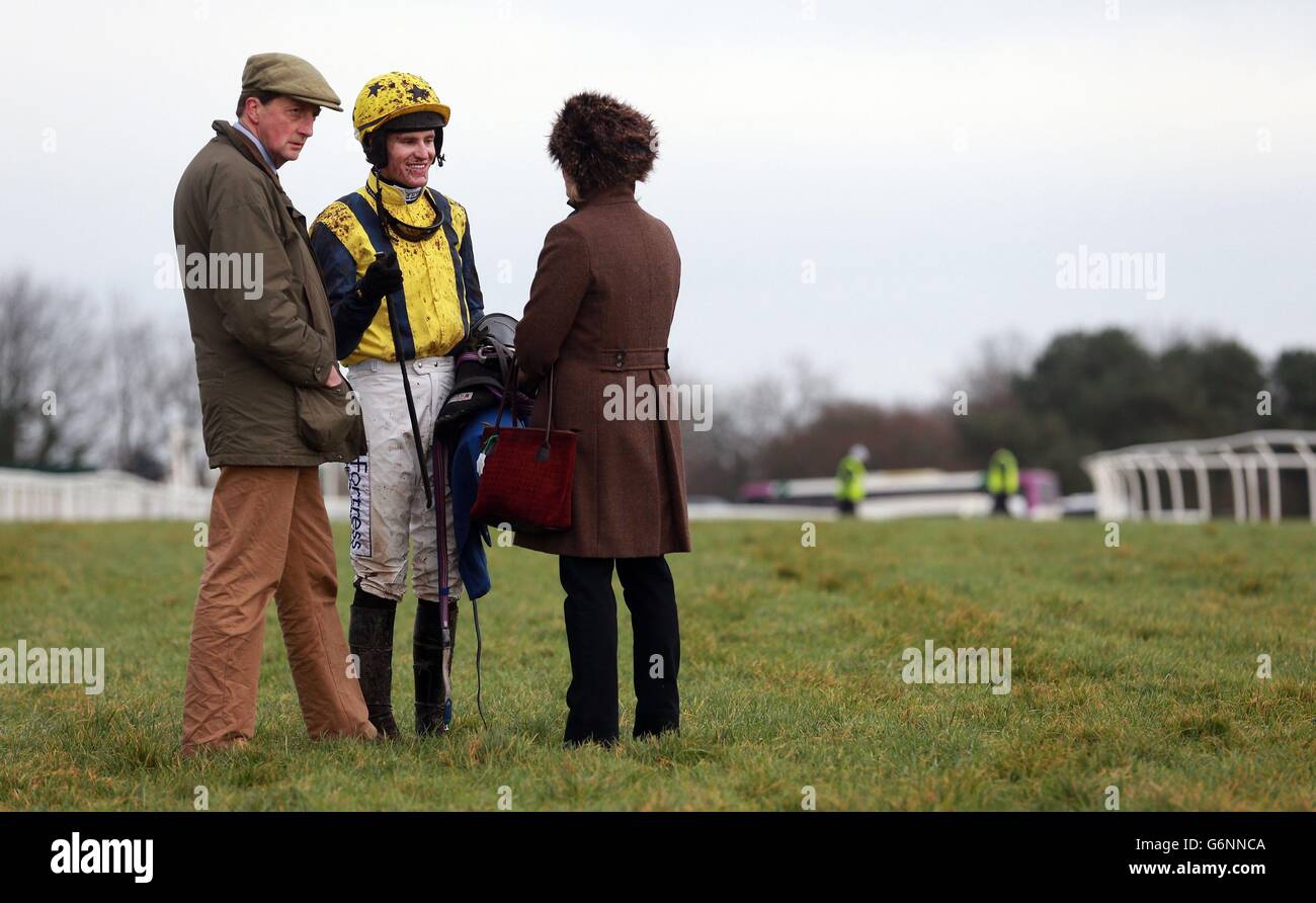 Jockey Nick Schofield (centre) with trainer Jeremy Scott (left) and the ...