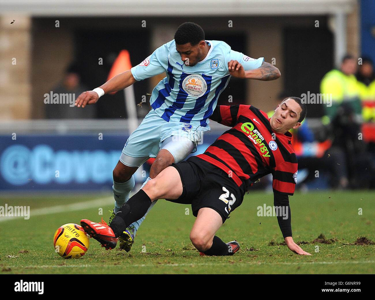 Coventry City's Cyrus Christie (left) and Peterborough United's Hogan ...