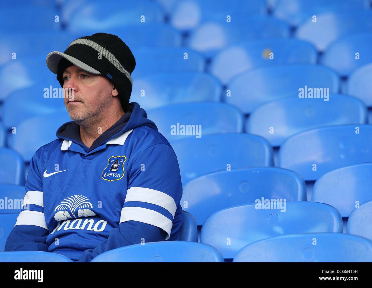 An Everton fan watches the team warm up from the stands Stock Photo - Alamy