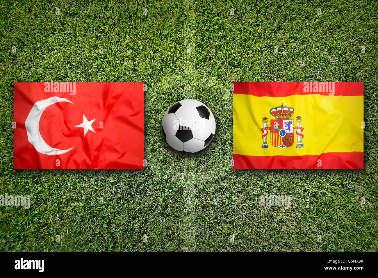 Turkey vs. Spain flags on green soccer field Stock Photo - Alamy