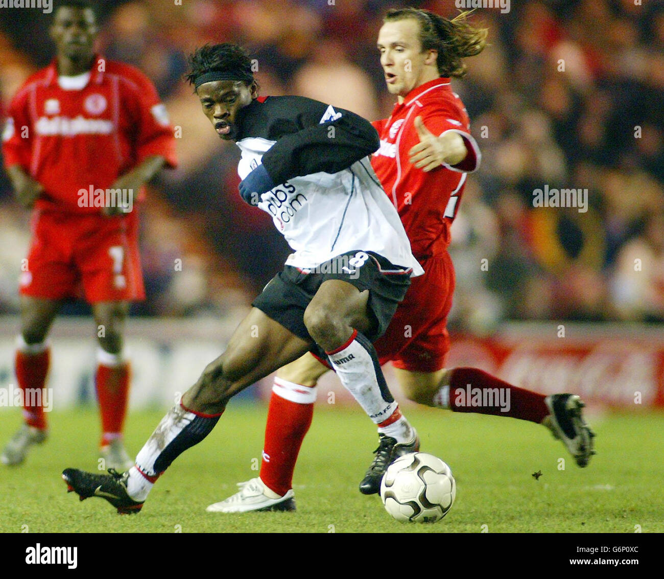 Fulham's Louis Saha gets past Middlesbrough's Bolo Zenden, during their ...