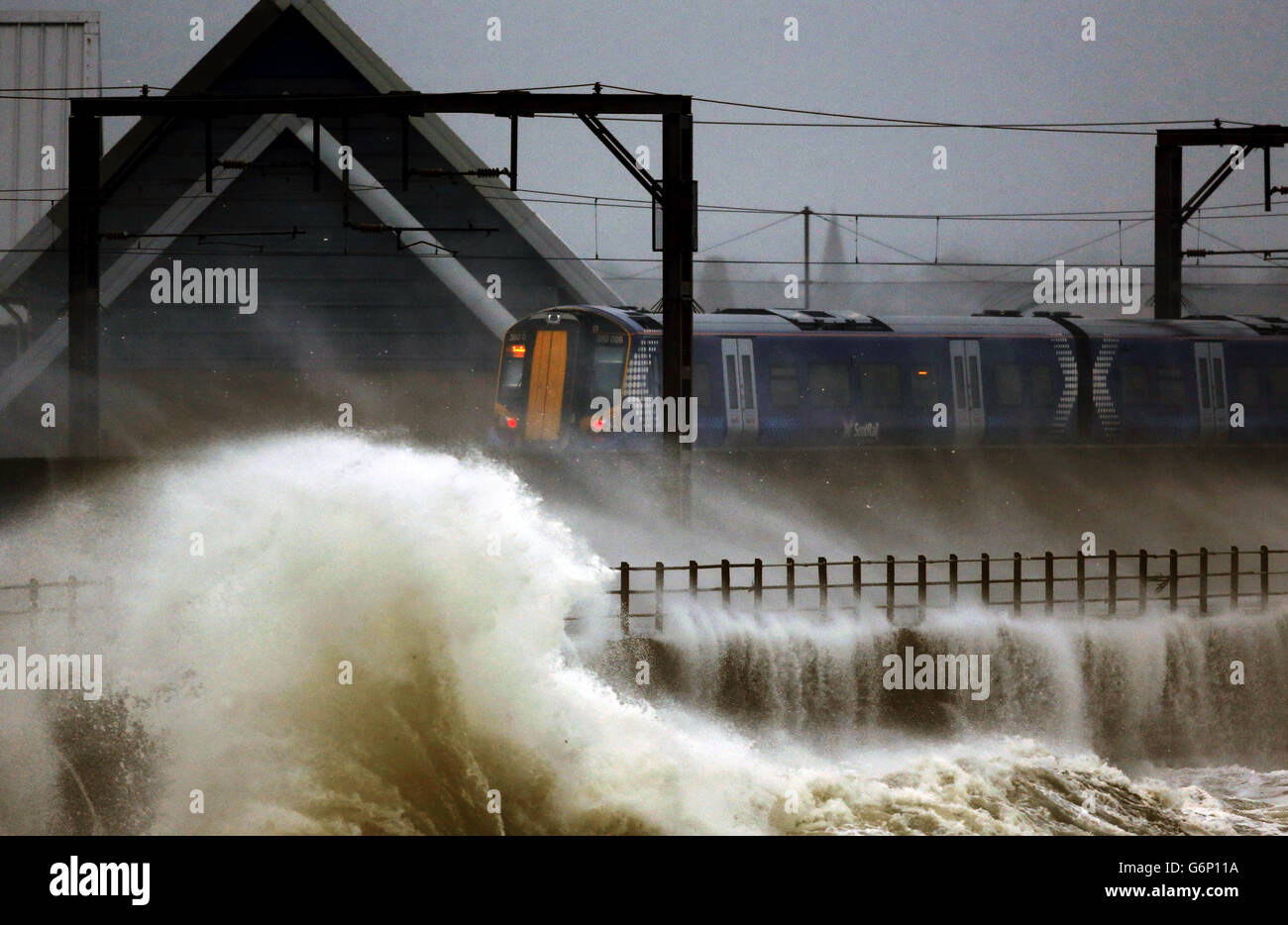 A train passes through the coast at Saltcoats in Scotland, as Britain ...