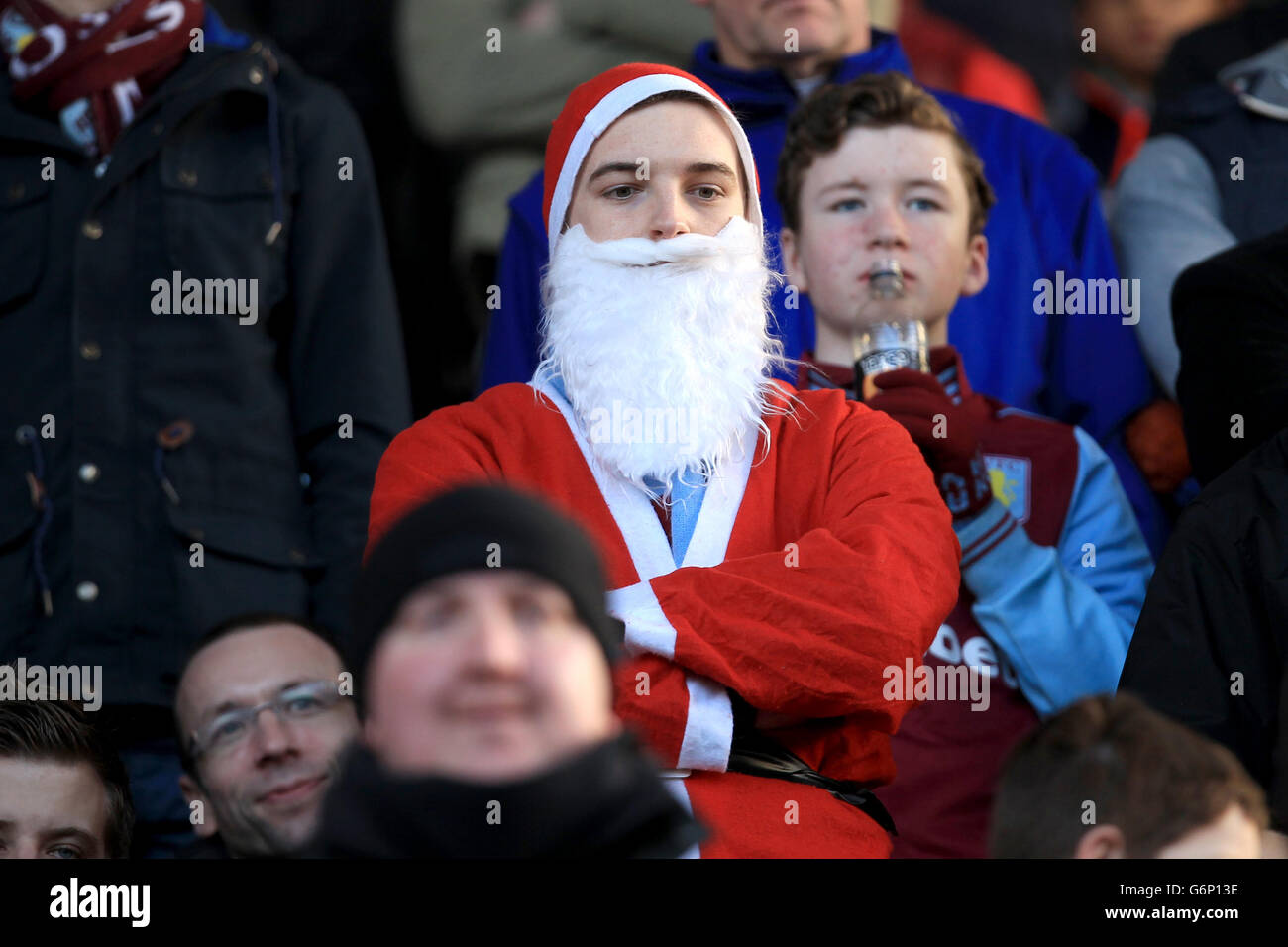 A fan dressed as santa in the stands hi-res stock photography and ...